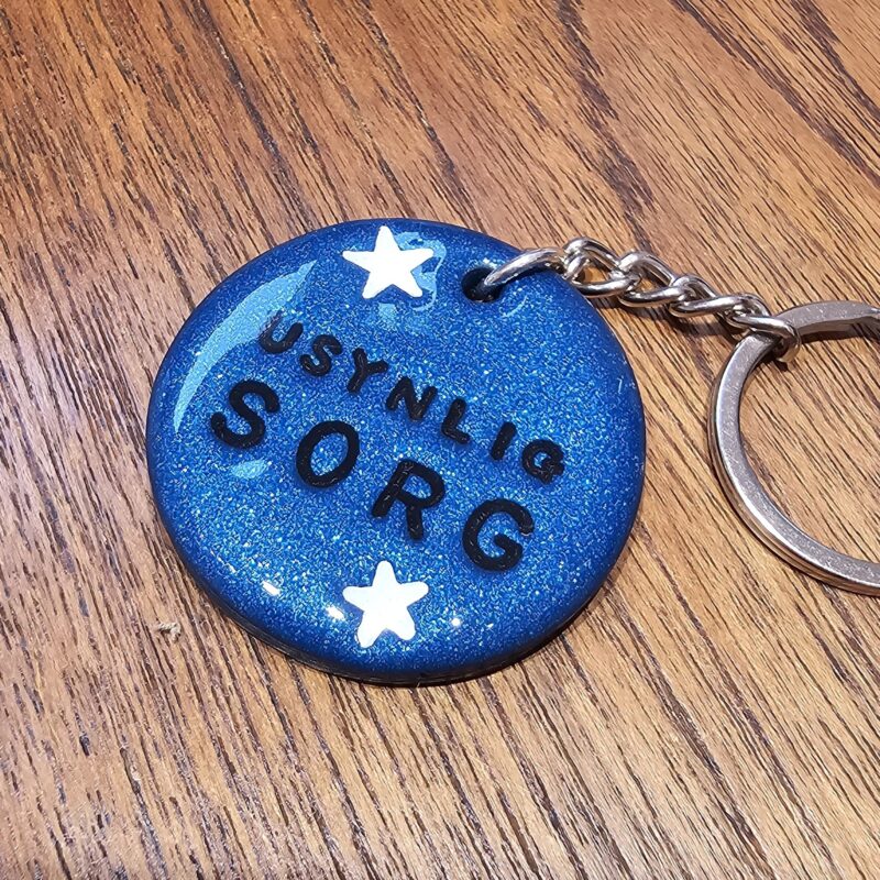 Usynlig sorg nøglering - Kritisk Pynt